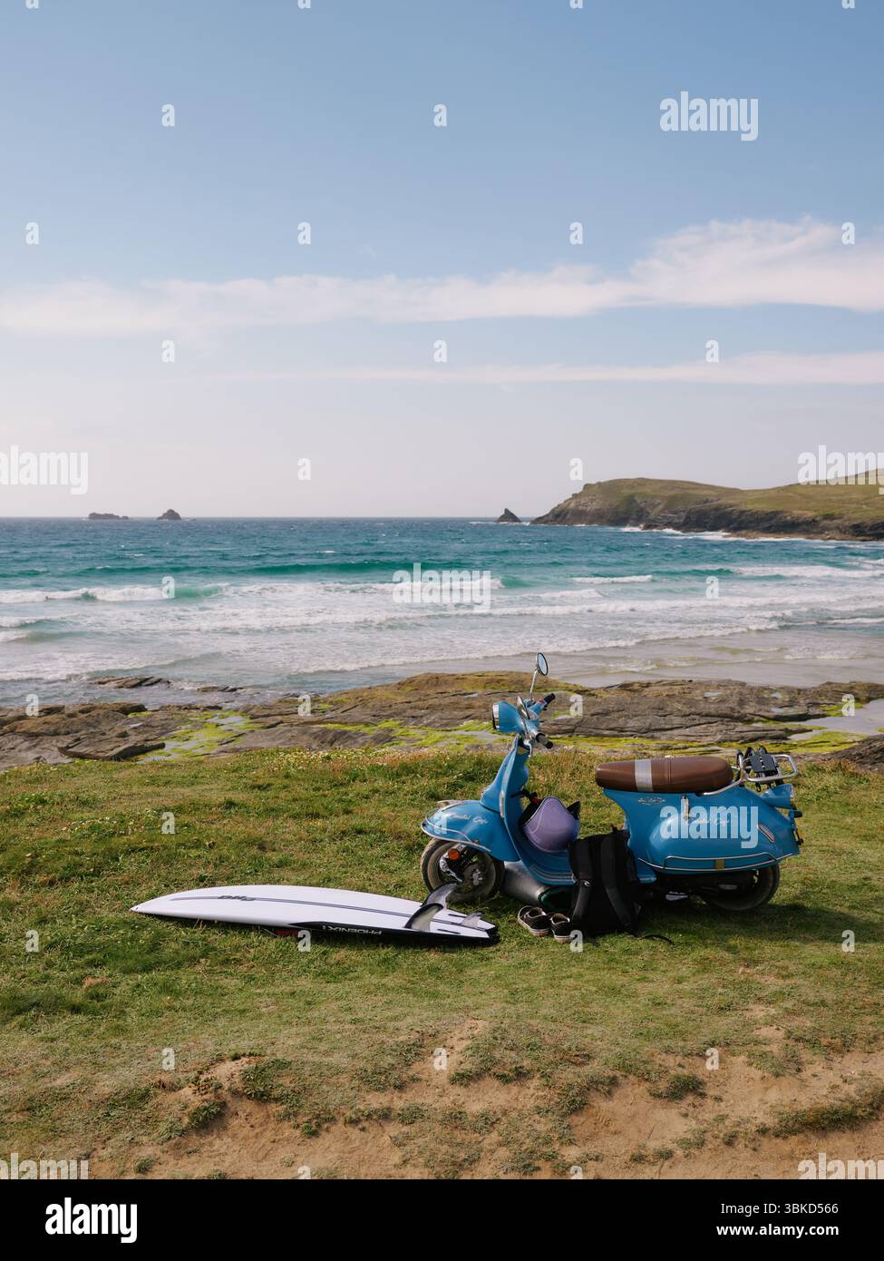A scooter and surfboard on the summer coast at Booby's Bay Beach, North ...
