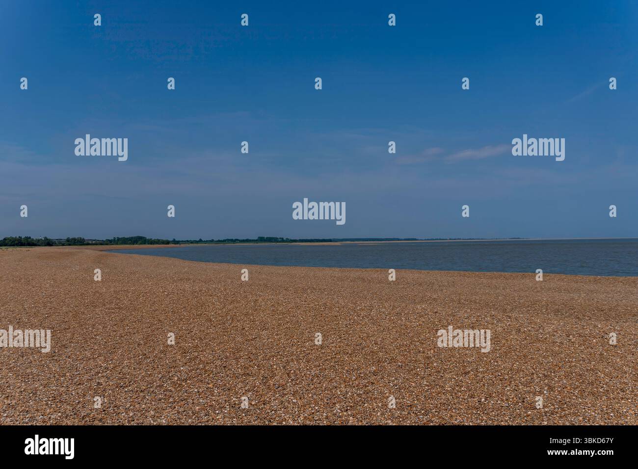 Blue skies over the beach at Shingle Street in Suffolk, UK Stock Photo ...