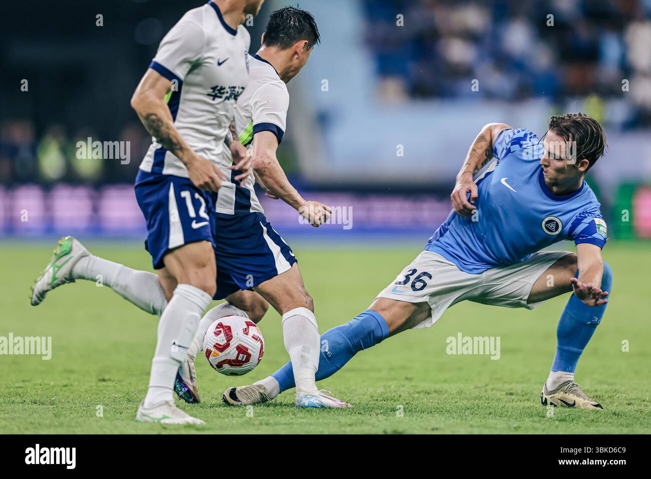 Wuhan Three Towns Football Club defeated Shenzhen Peng City Football Club with 2-1 at the ...