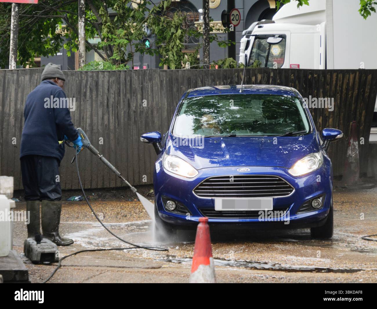 Staff at the American Hand Car Wash operate inside the NCP Great ...