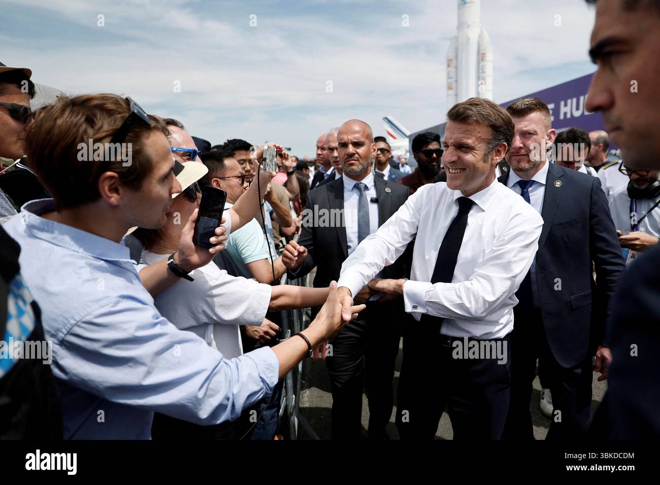 French President Emmanuel Macron shakes hands with visitors at the 55th International Paris ...