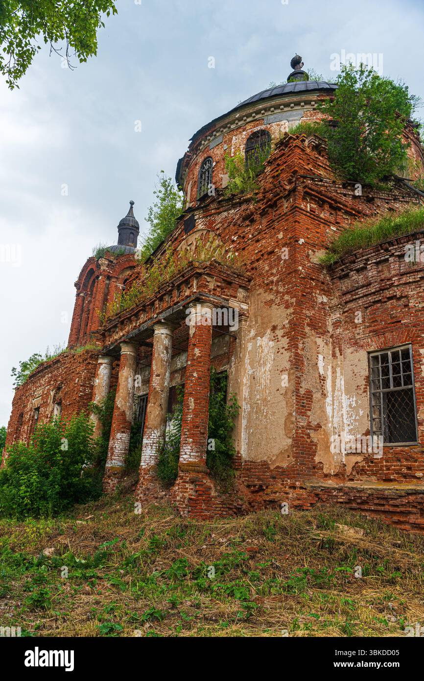 A crumbling historic red brick building. The church is in a dilapidated ...