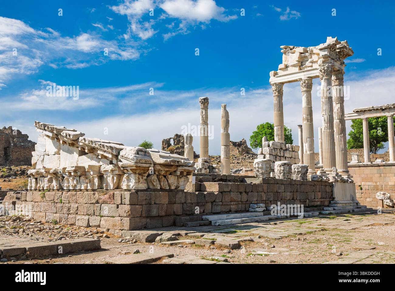 Ruins of the Temple of Trajan with marble columns stand atop the ...