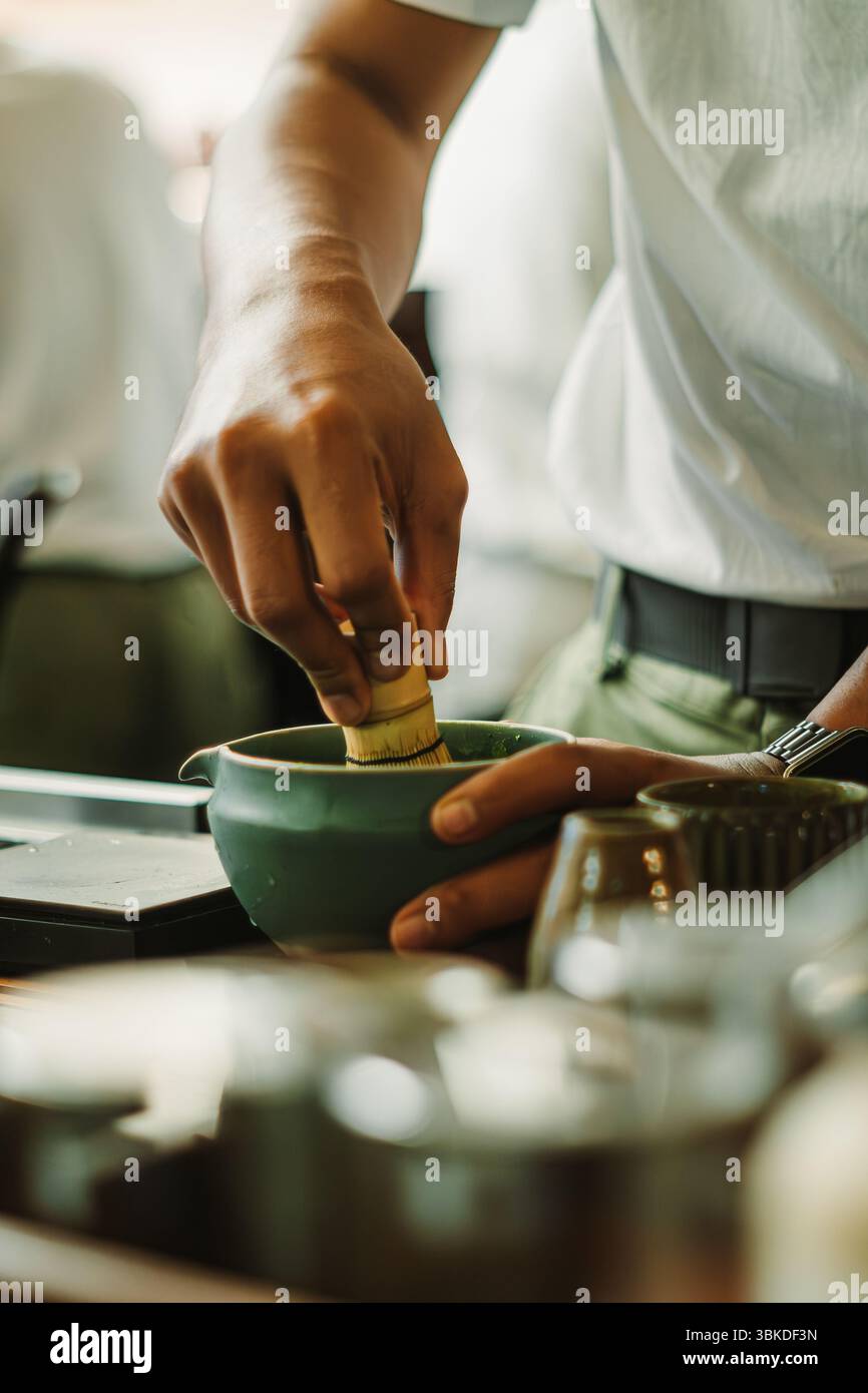 Hands whisking matcha. A traditional Japanese green tea. The calming ...