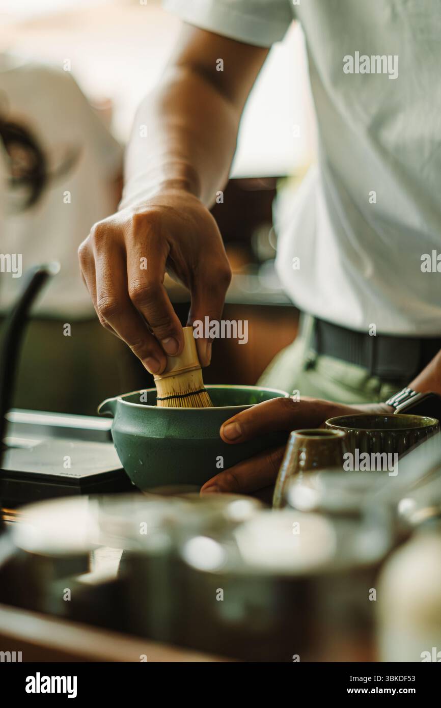 Hands whisking matcha. A traditional Japanese green tea. The calming ...