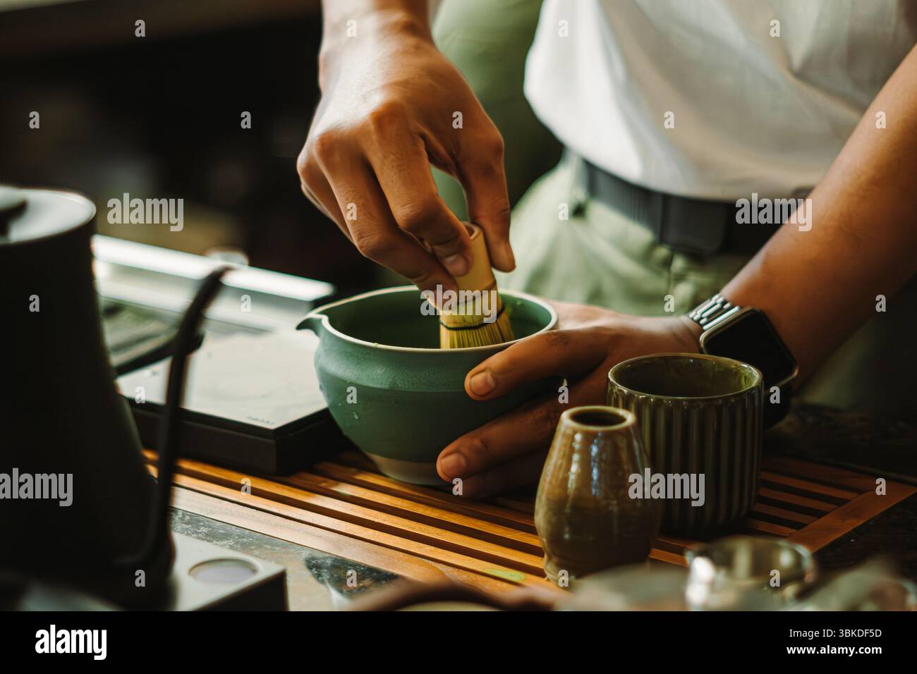 Hands whisking matcha. A traditional Japanese green tea. The calming ...