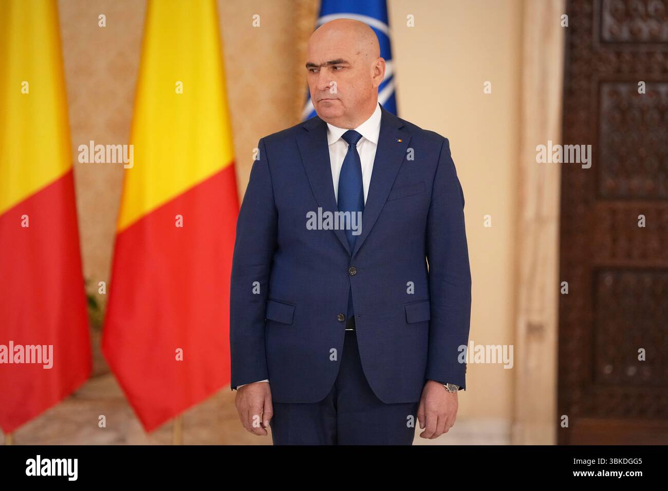 Ilie Bolojan, the President of the country's senate, stands as Romanian ...