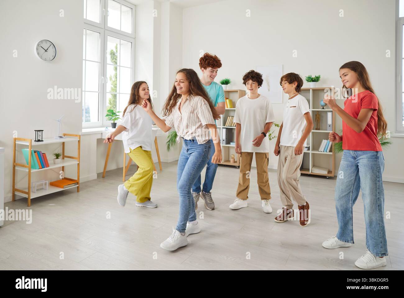 Happy Schoolchildren Playing Together During Break In Classroom Stock ...