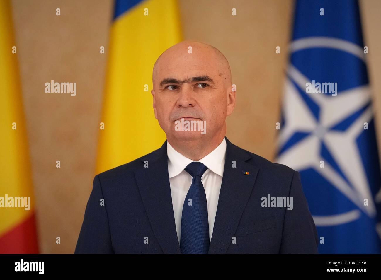 Ilie Bolojan, the President of the country's senate, stands as Romanian ...