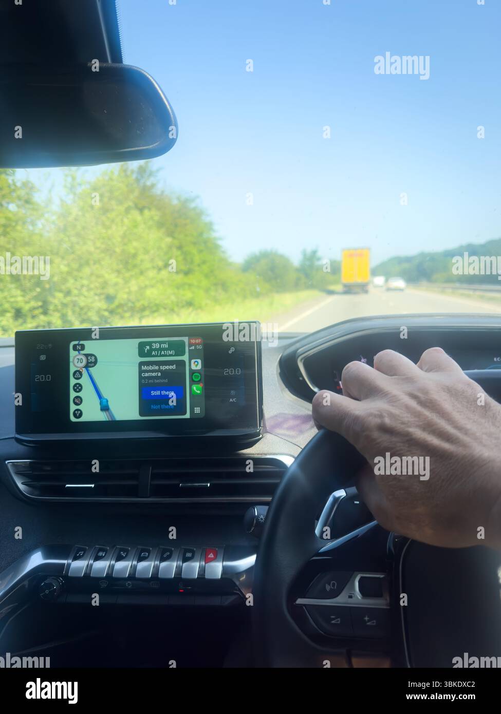 19 JUN 2025 - Cambridge, UK - Driving on a road trip whilst following ...