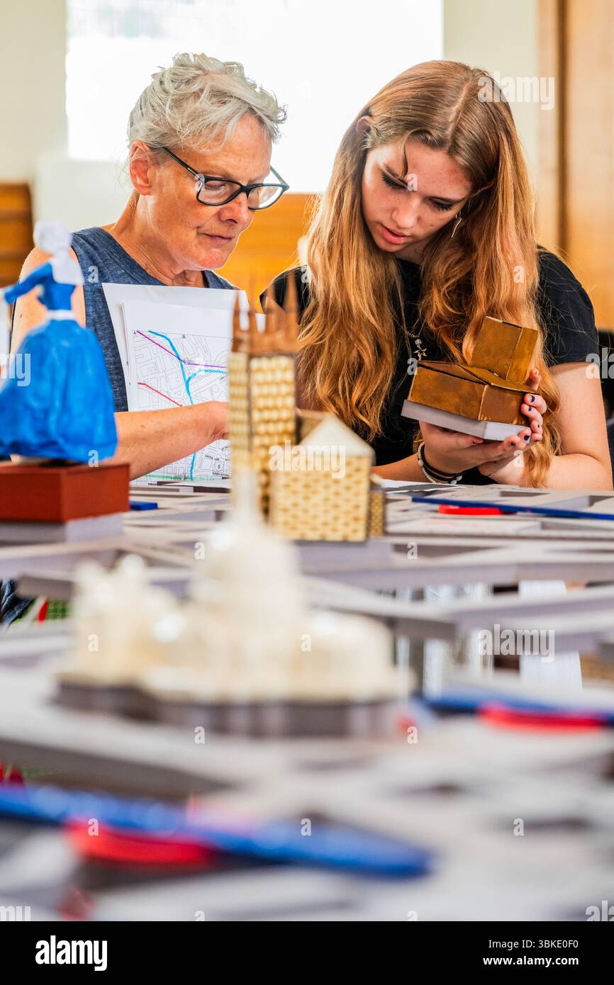 London, UK. 20 Jun 2025. Cathy Wren makes final adjustments with a student from City of London ...