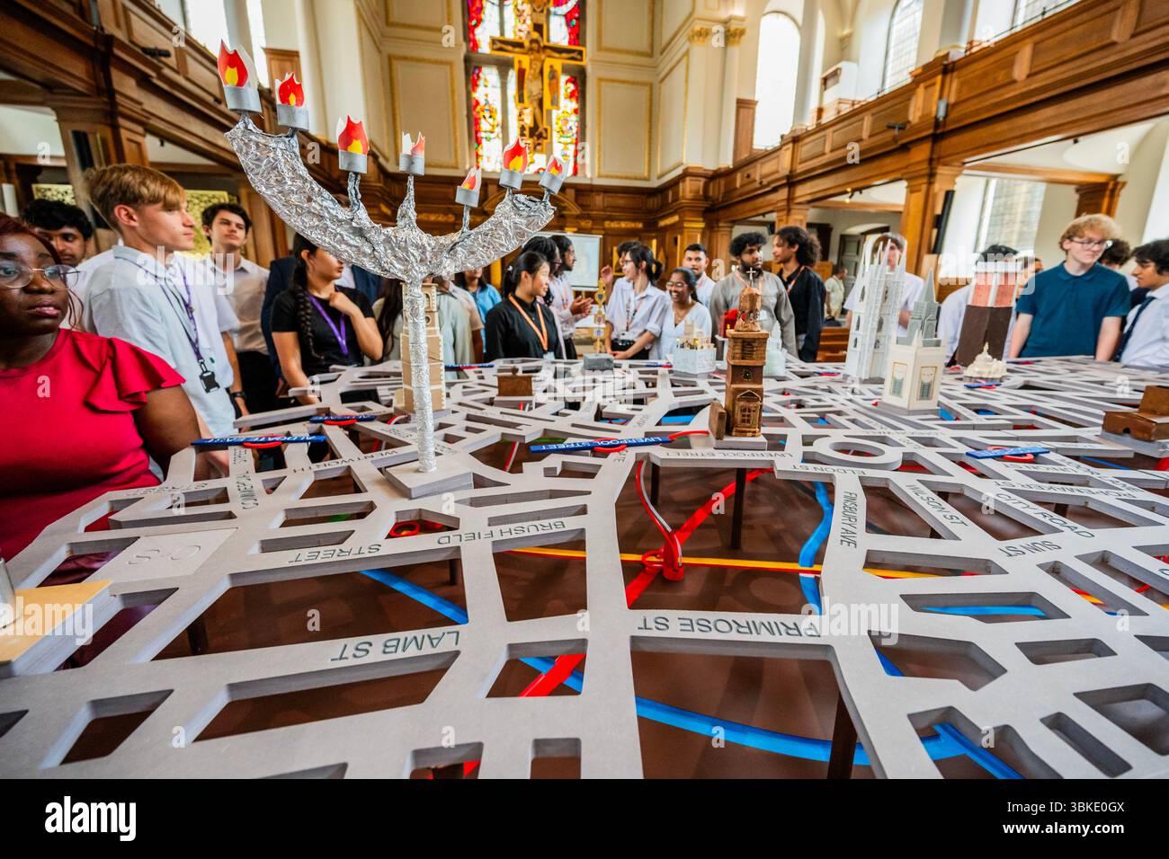 London, UK. 20 Jun 2025. The completed map comes together and then is inspected above and below ...
