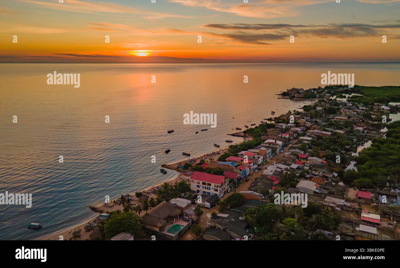 Aerial view of Rincón del Mar at sunset, showcasing vibrant colors and ...