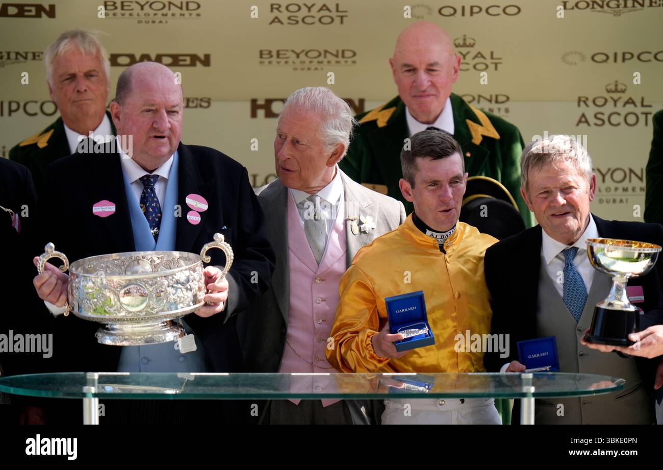 King Charles III presenting trophies to winning jockey Gary Carroll and ...