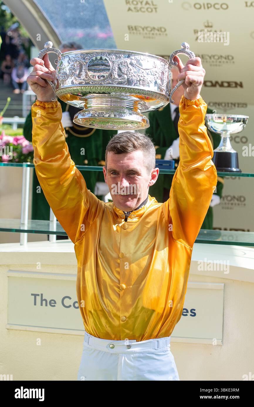 Ascot, Berkshire, UK. 20th June, 2025. Jockey G F Carroll holds up the ...