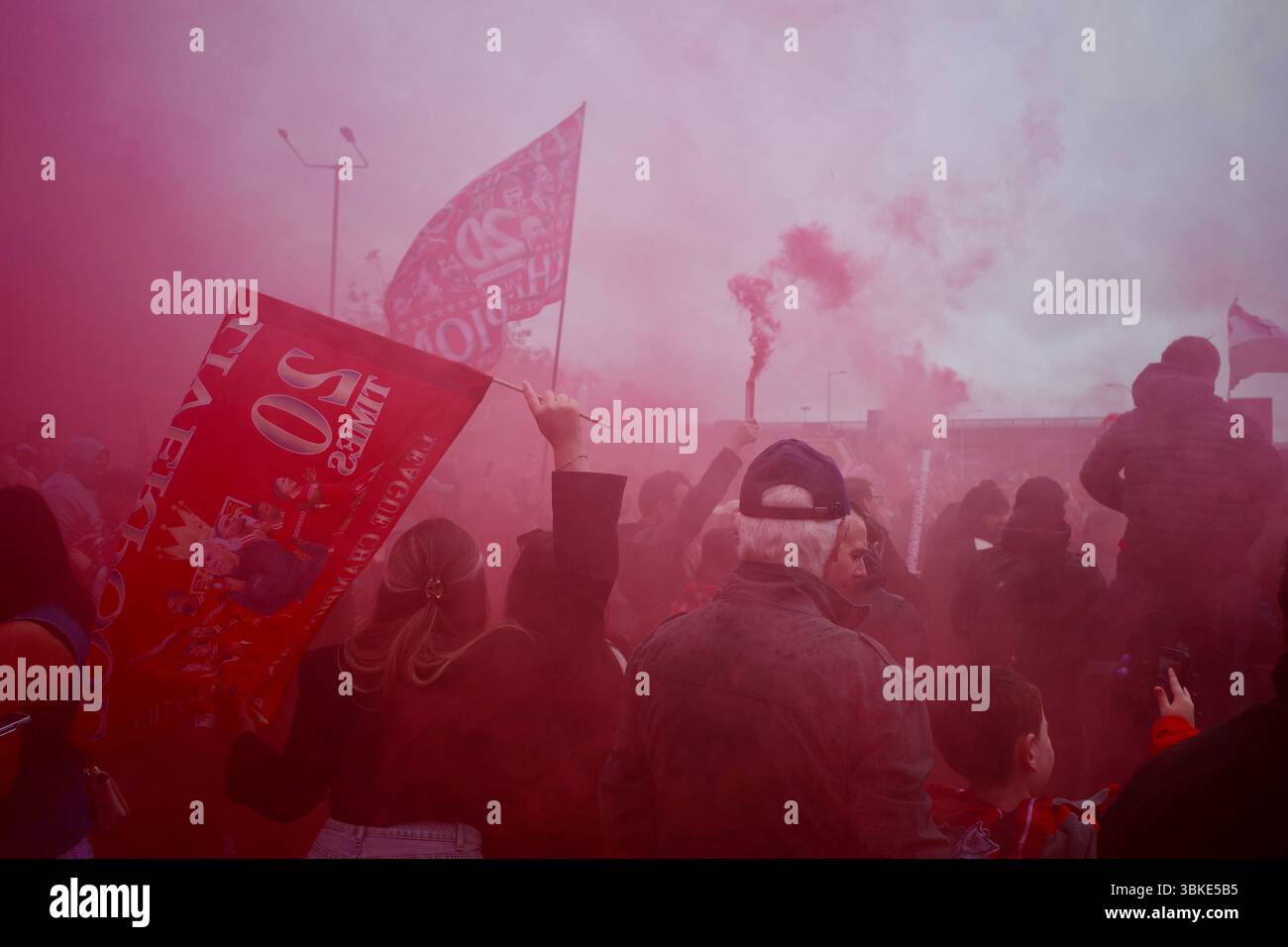 Female Fan Waving Flag Amid Red Smoke at Liverpool FC Premier League ...