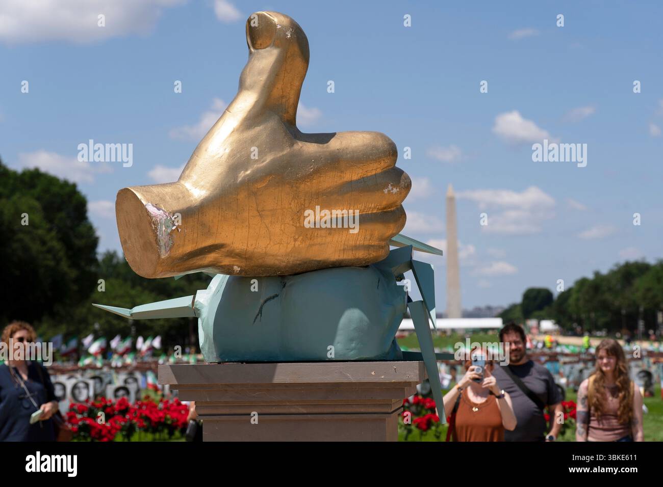 Visitors observe an art installation titled "Dictator Approved" on the ...
