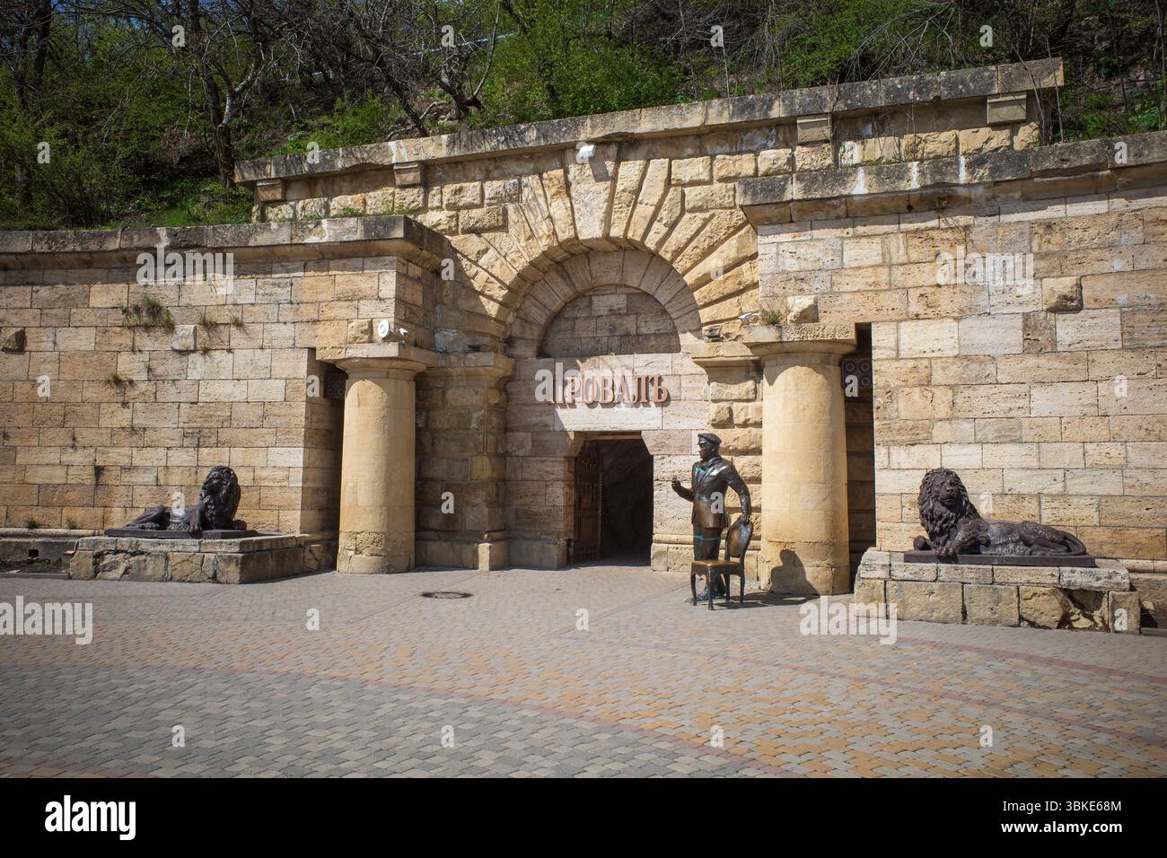 Proval cavern, entrance. Bronze statue of Ostap Bender, fictional ...