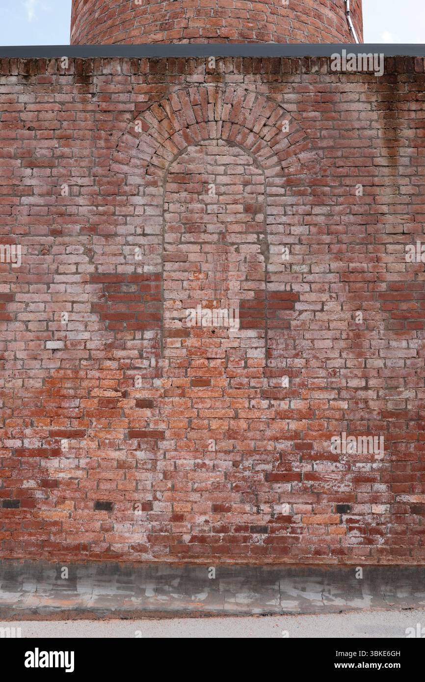 Opening in a brick wall was bricked up with bricks Stock Photo - Alamy