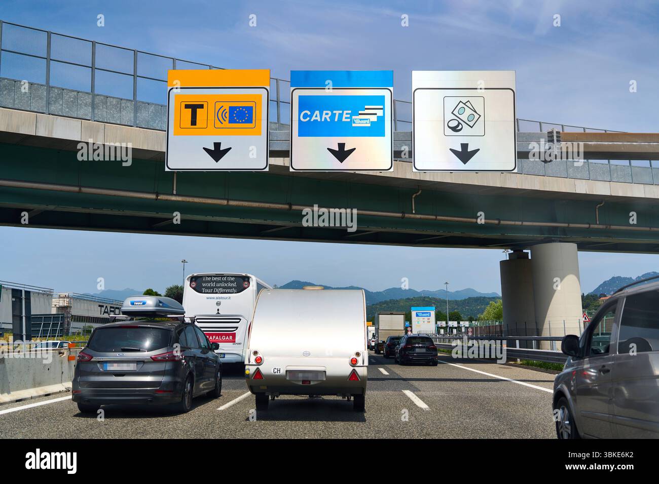 Italy - June 15, 2025: Signs at a toll station in Italy show lanes for ...