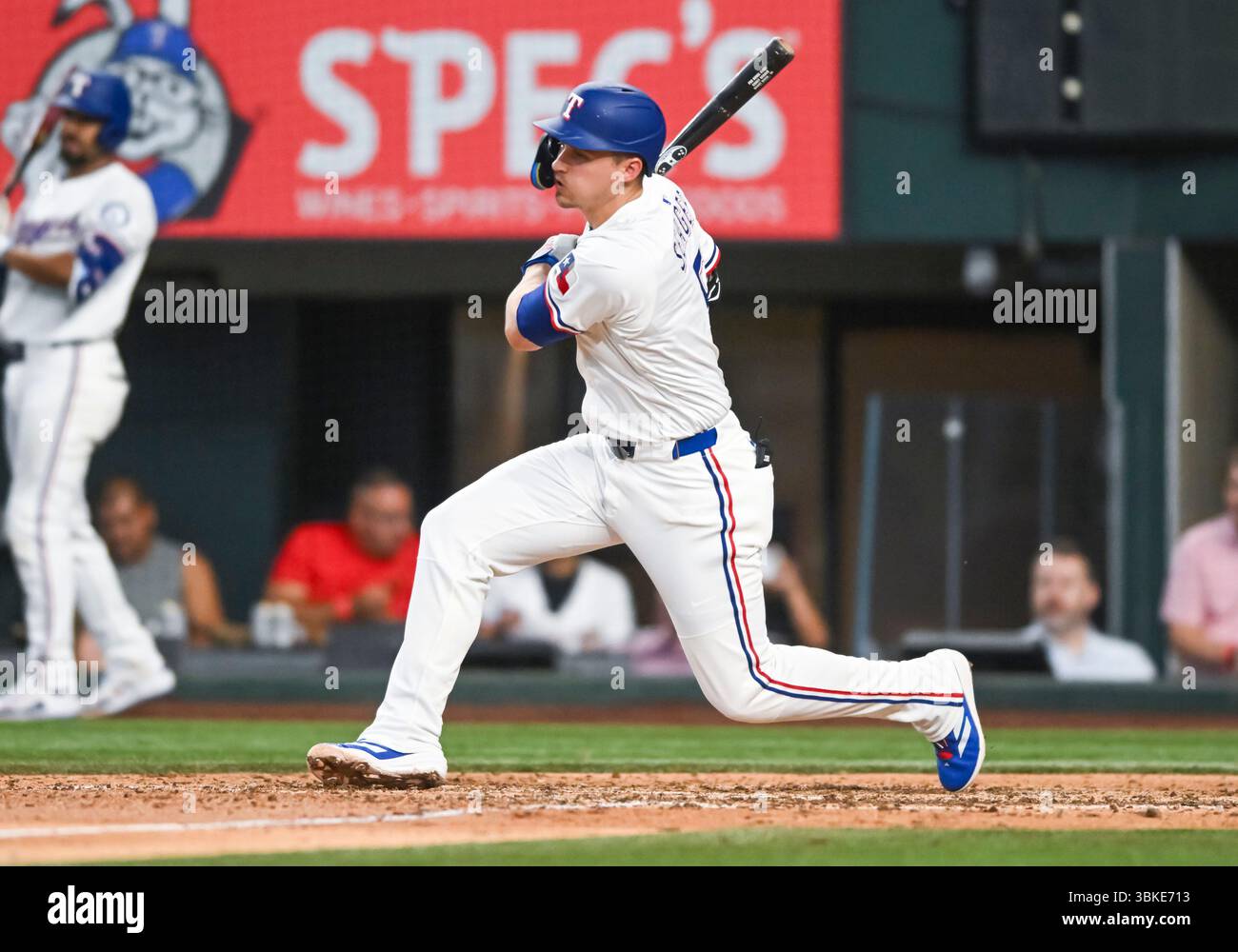 Texas Rangers' Corey Seager makes contact for a ground ball during a ...