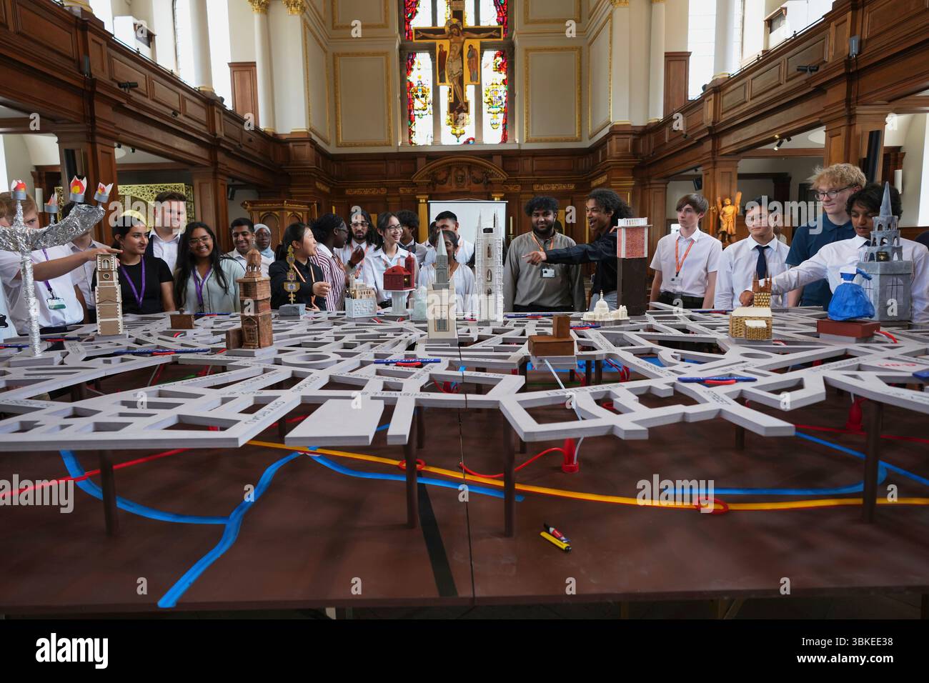 Students, engineers and map designers look at the newly unveiled 3D map ...