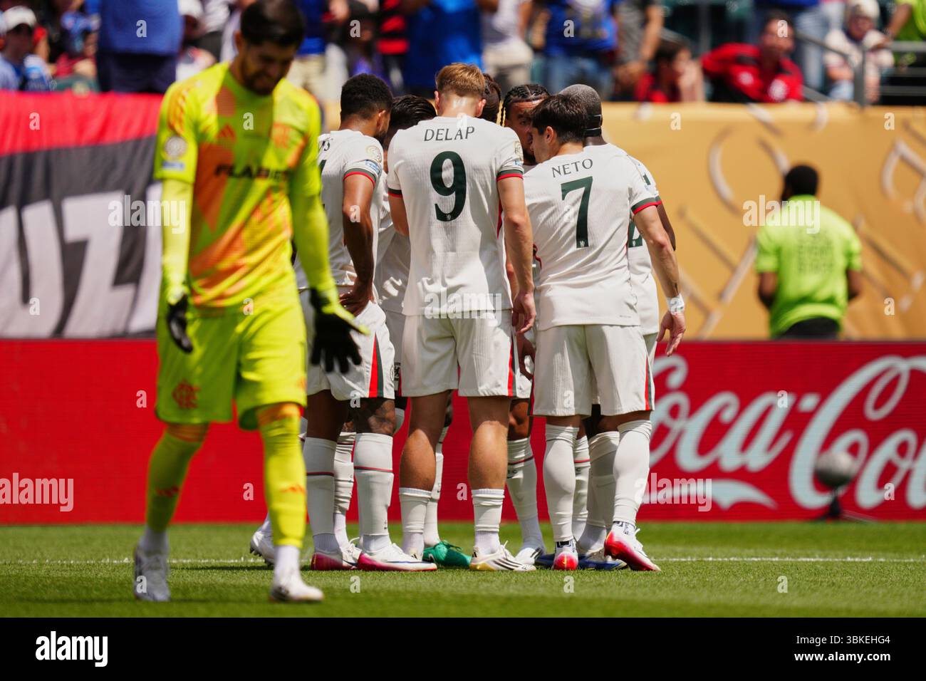 Chelsea players huddle after scoring the opening goal during the Club ...