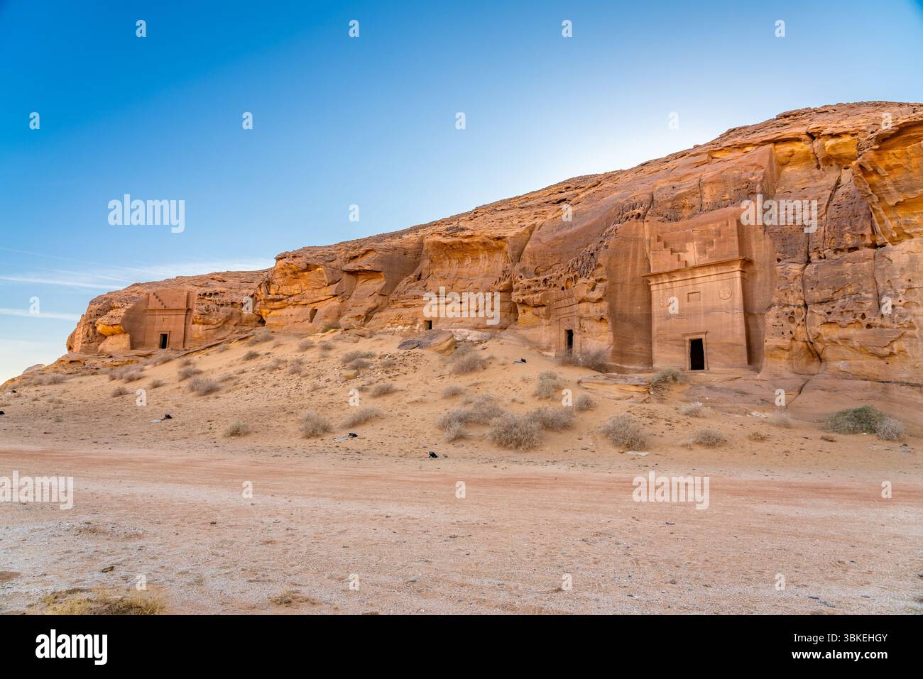 Jabal AlAhmar, carved sandstone rock at sunset, ancient tombs of Hegra ...