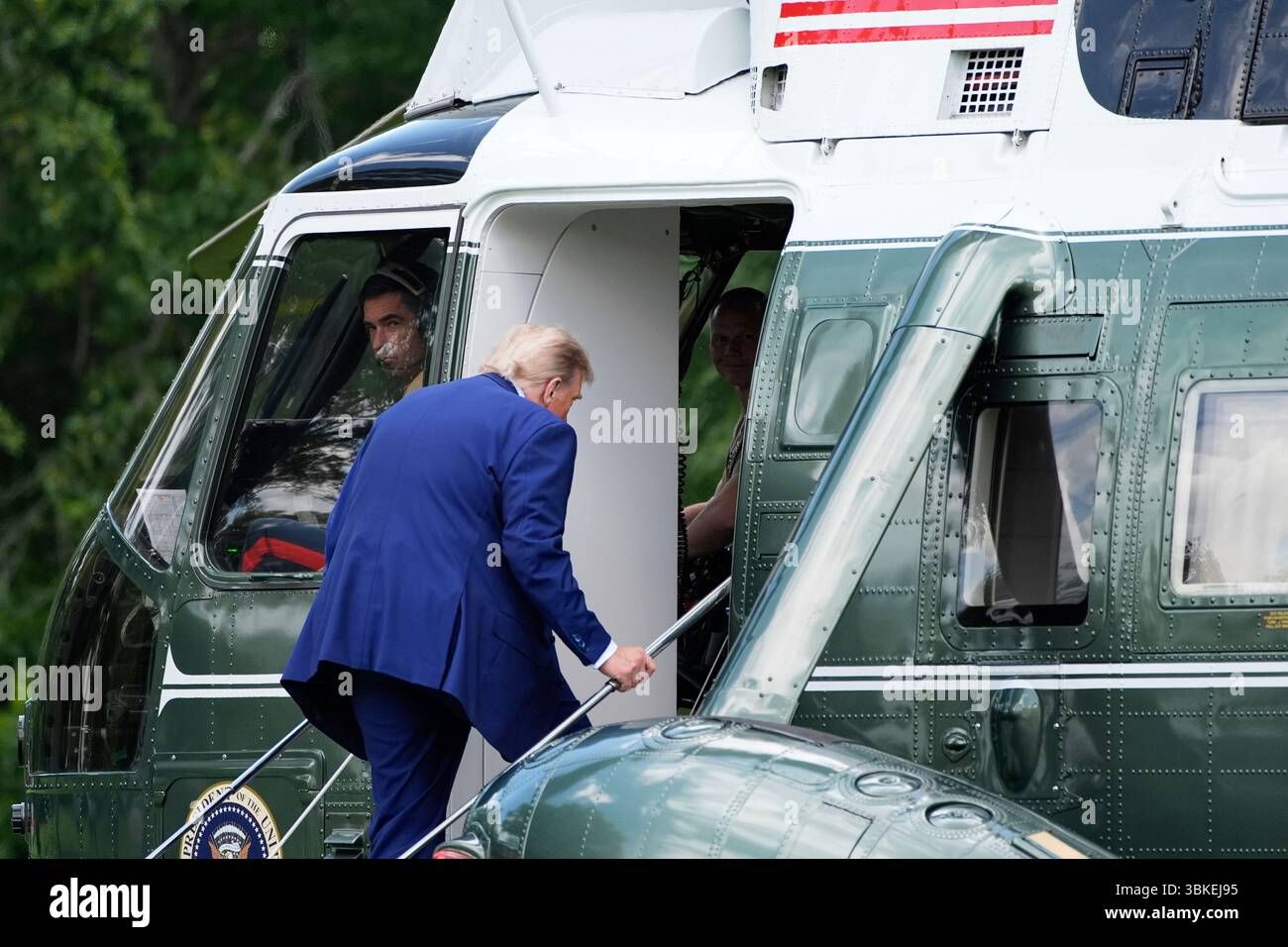 President Donald Trump boards Marine One as he departs from the South ...