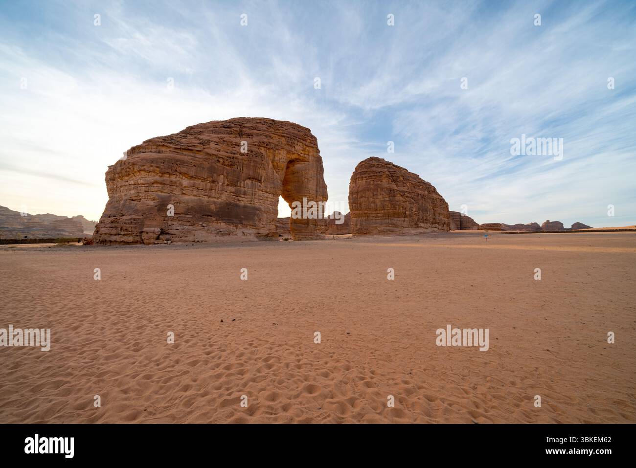 The panoramic desert landscape of AlUla at sunset, frames the Elephant ...