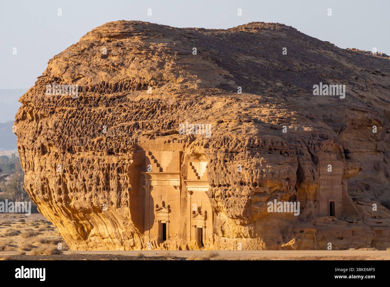 Jabal AlAhmar, carved sandstone rock at sunset, ancient tombs of Hegra ...
