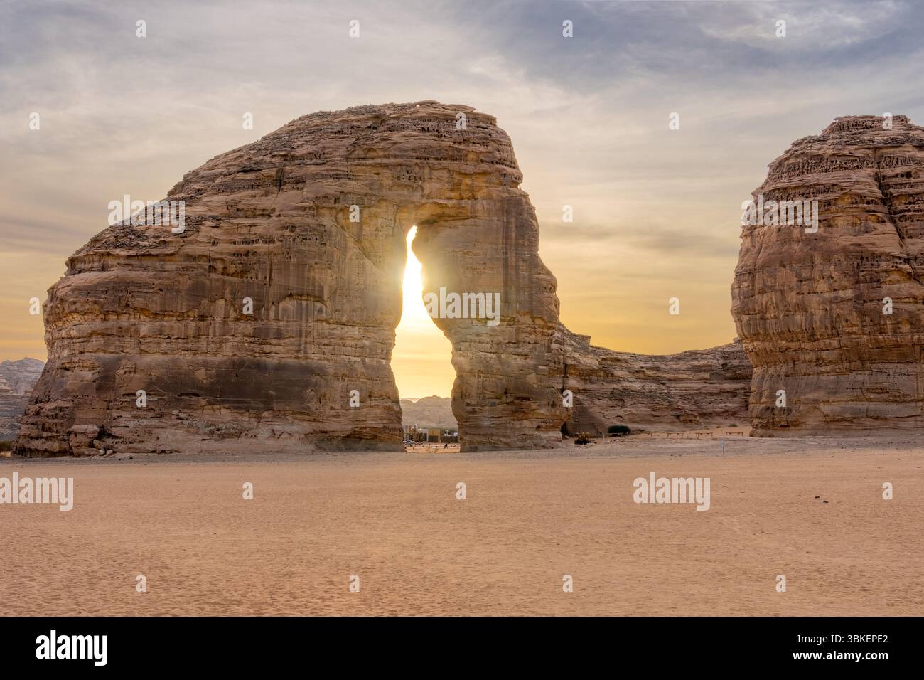 The panoramic desert landscape of AlUla at sunset, frames the Elephant ...