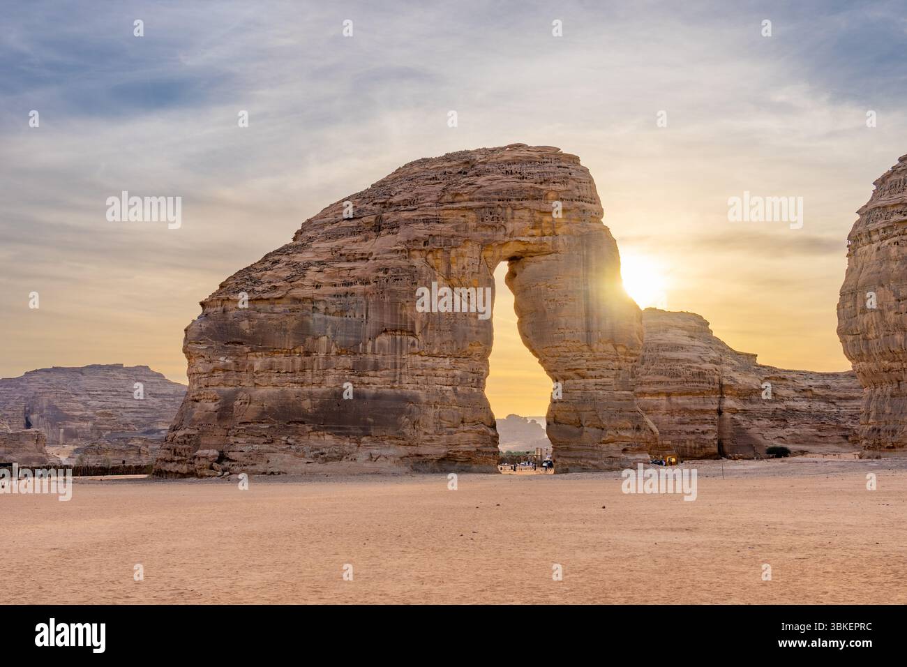 The panoramic desert landscape of AlUla at sunset, frames the Elephant ...