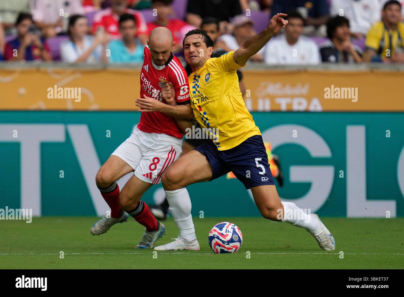Benfica's Fredrik Aursnes, left, and Auckland City's Nikko Boxall fight ...