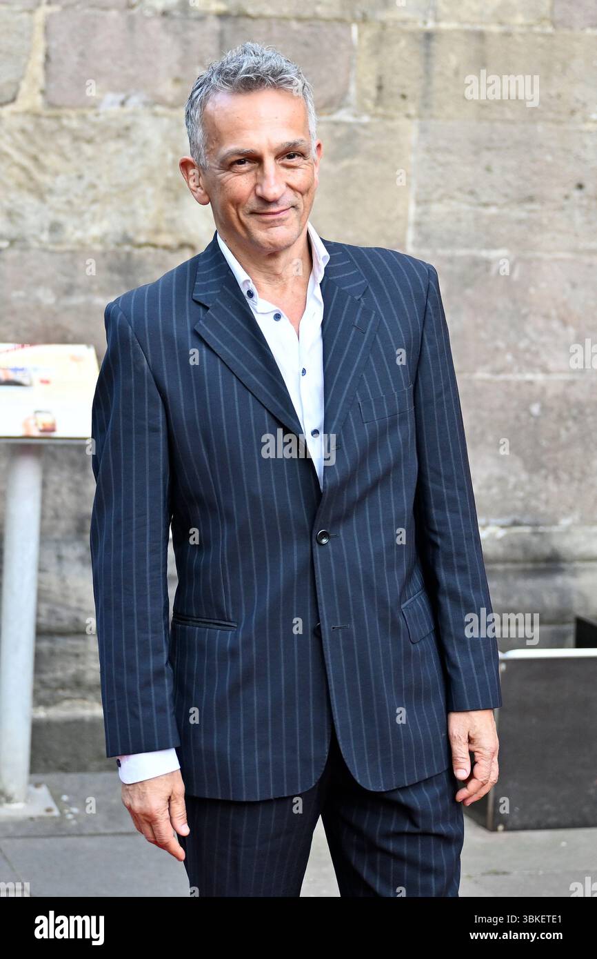 Bad Hersfeld, Germany. 20th June, 2025. Henry Arnold, actor, walks the ...