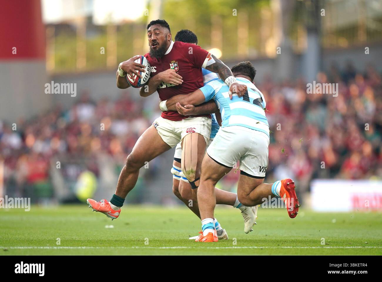 British and Irish Lions' Bundee Aki (left) is tackled by Argentina's ...