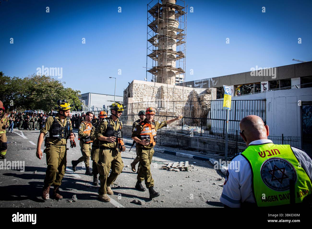 Israeli first responders arrive at a site of an Iranian ballistic ...