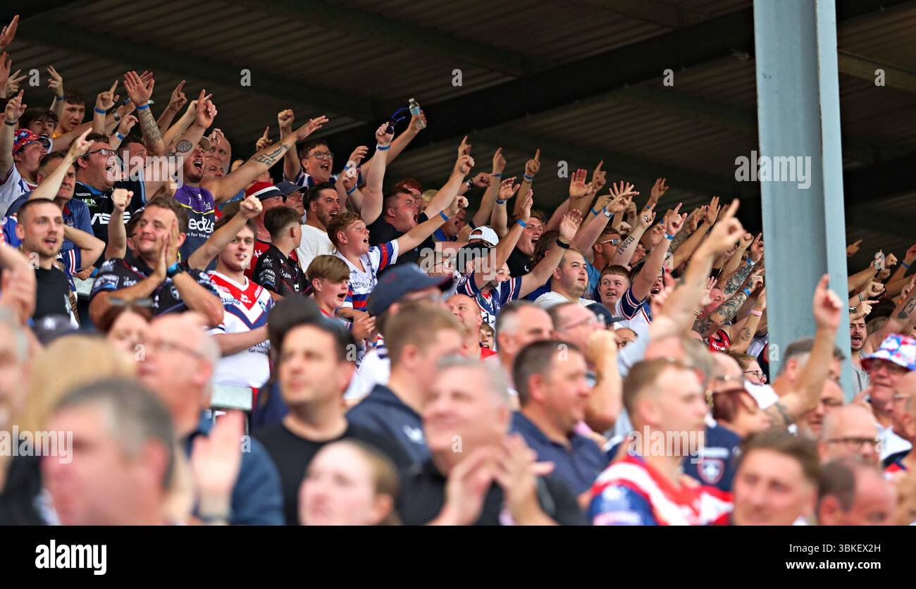Wakefield fans celebrate the try scored by Caius Faatili of Wakefield ...