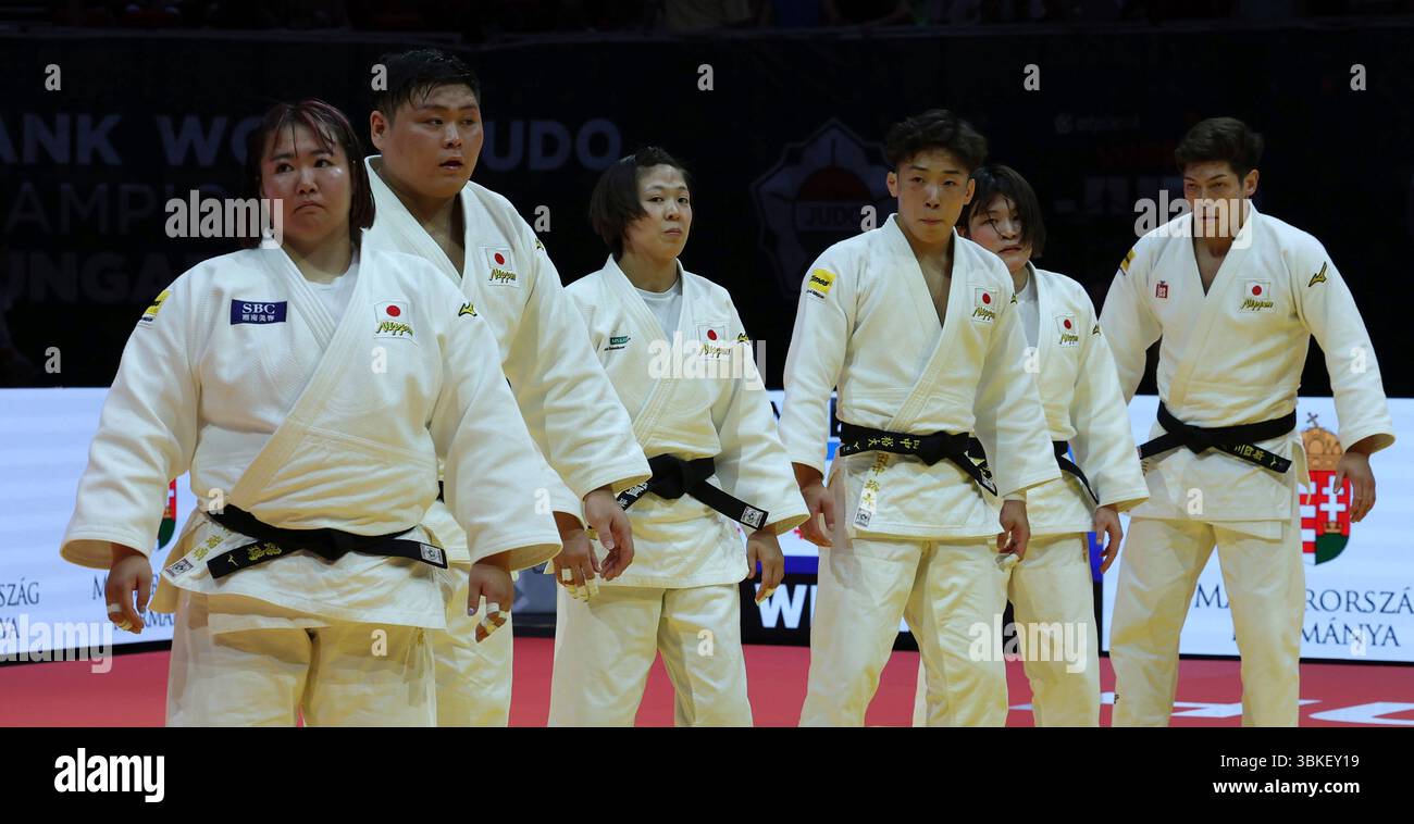 Japan's team members react after losing the semi-final contest against ...
