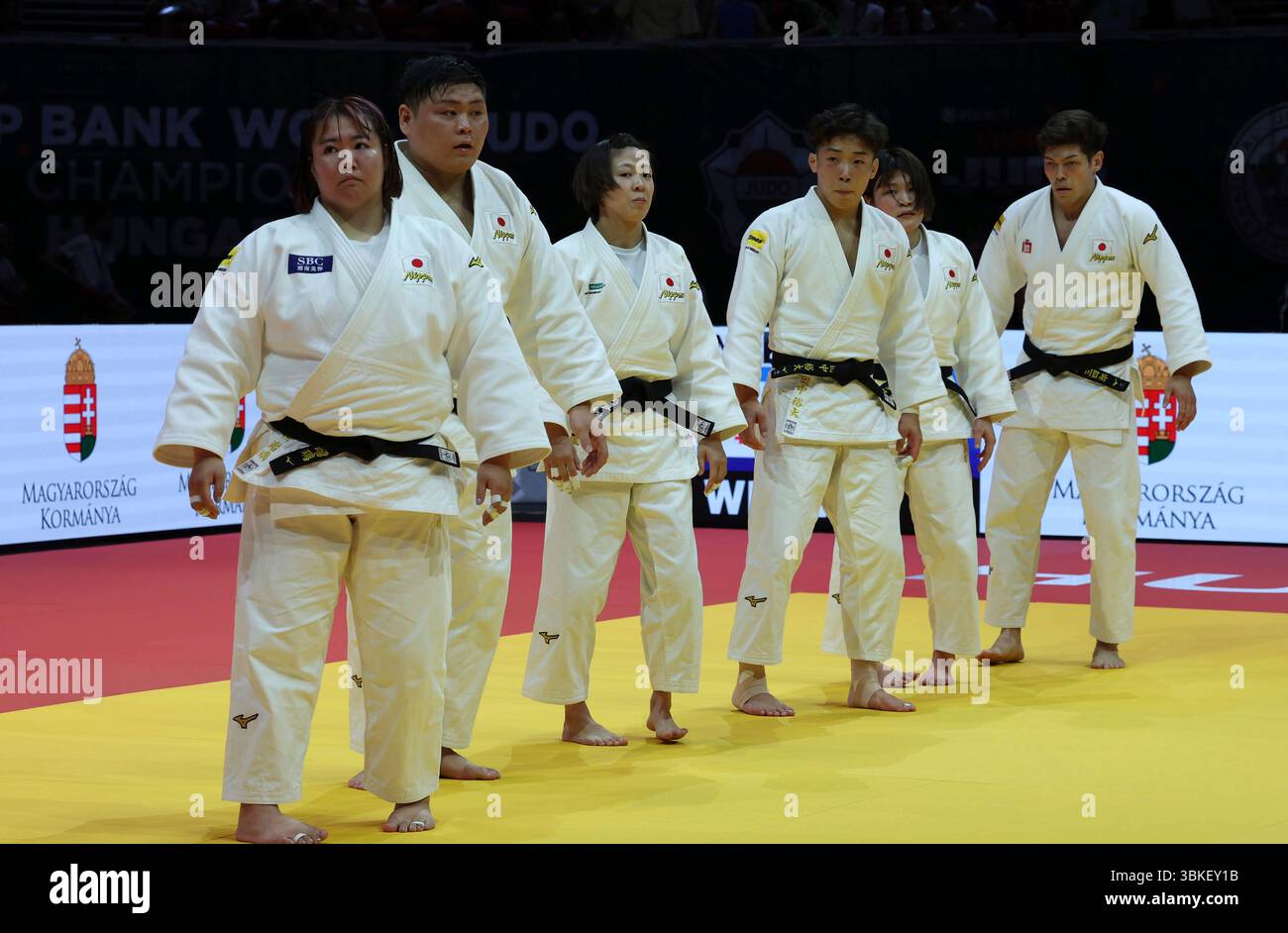 Japan's team members react after losing the semi-final contest against ...