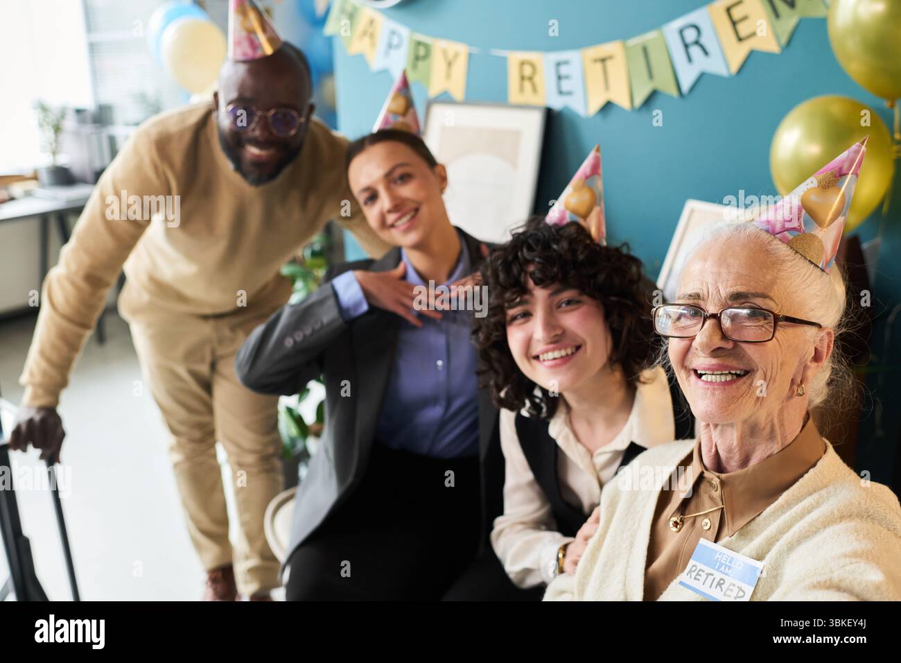 Cheerful diverse colleagues in party hi-res stock photography and ...
