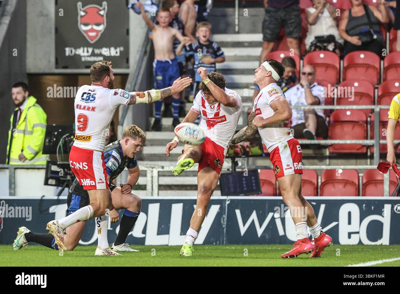Owen Dagnall of St. Helens celebrates his try during the Betfred Super ...