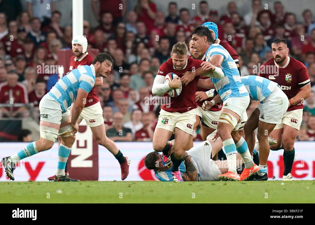 British and Irish Lions' Elliot Daly (centre) attempts to get past ...