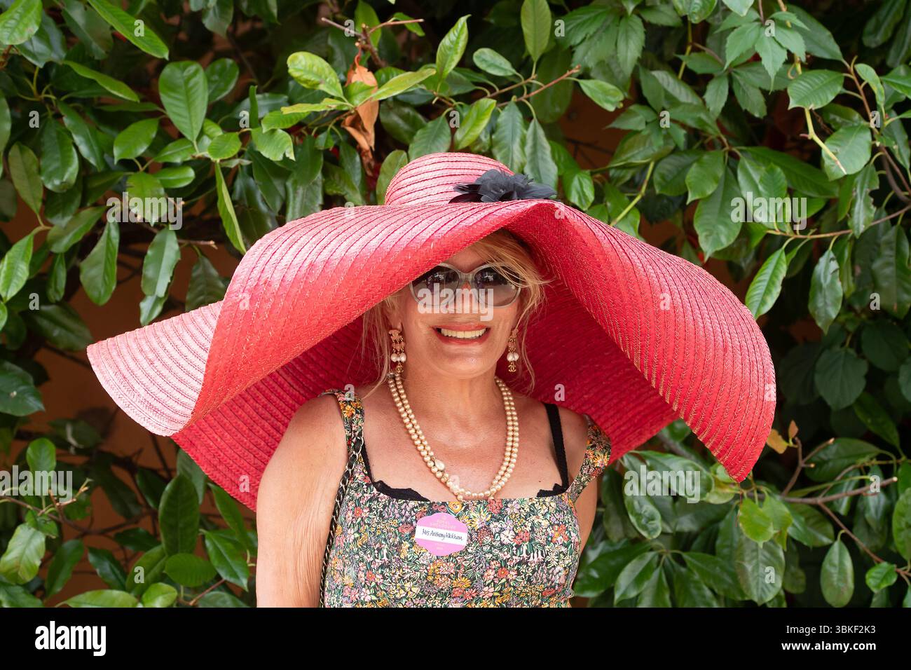 Ascot, Berkshire, UK. 20th June, 2025. Mrs Anthony Wickham wears a huge ...