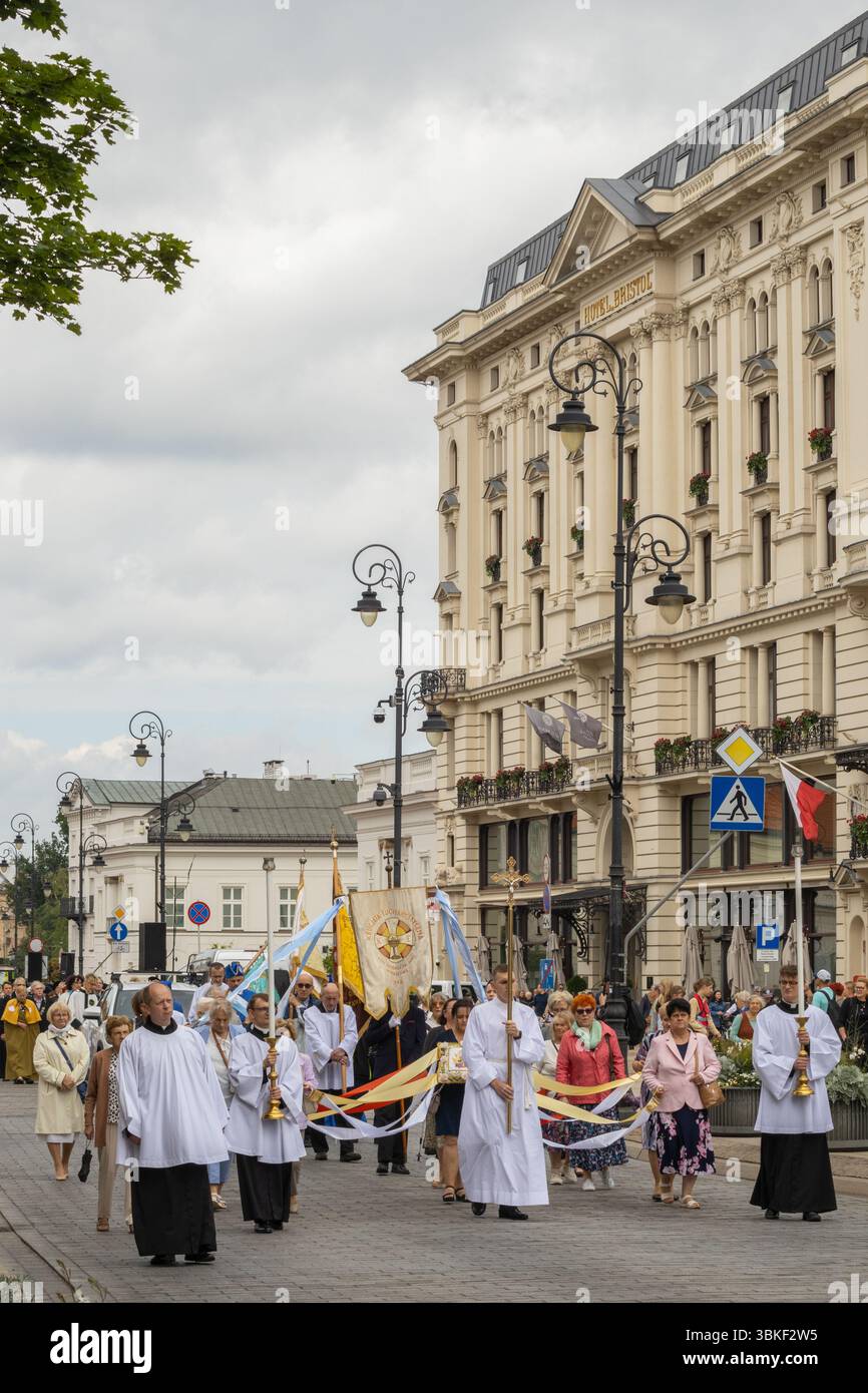 A group of Catholic priests, altar servers and parishioners lead a ...