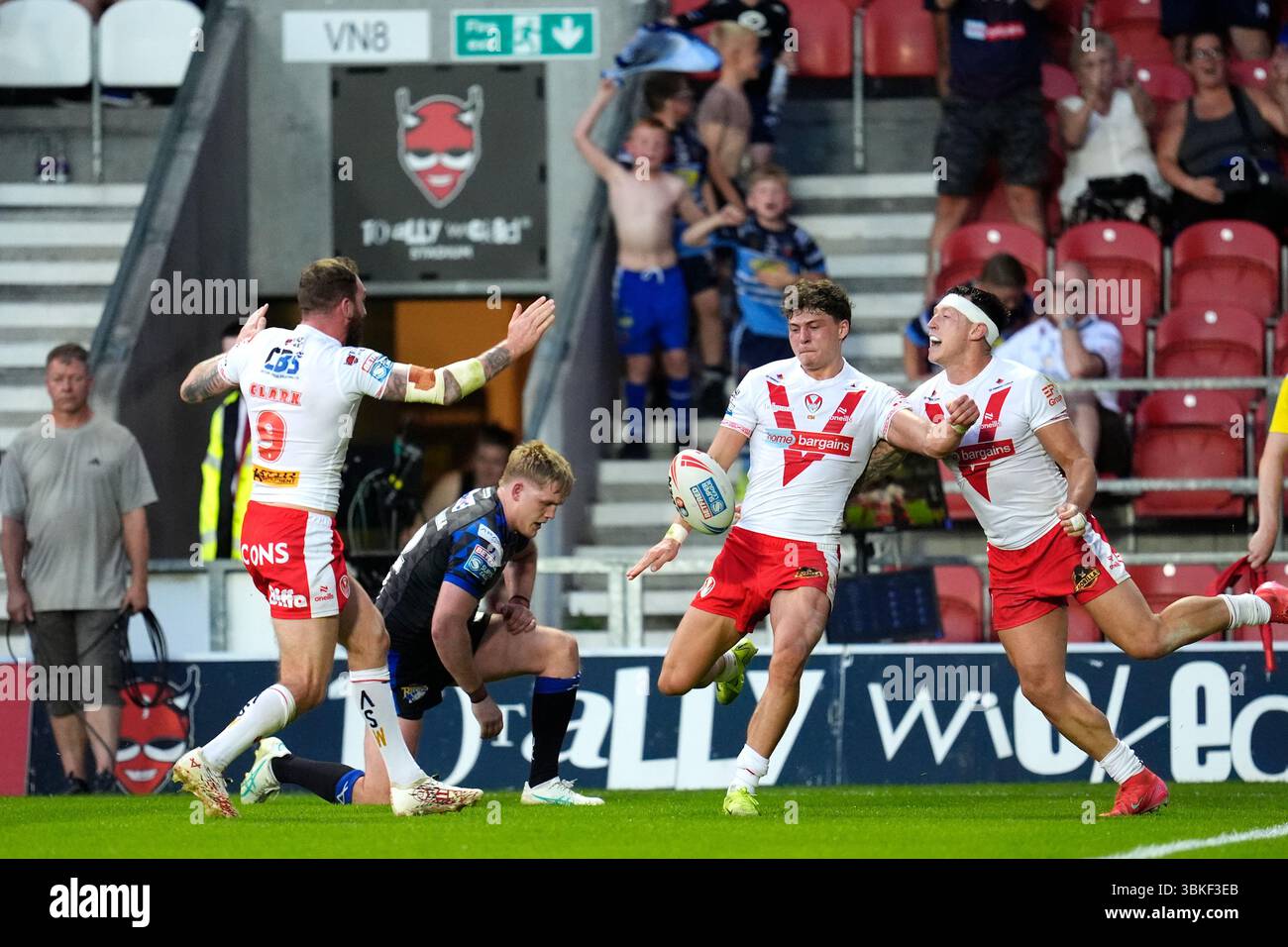St Helens' Owen Dagnall (centre) celebrates scoring his side's second ...
