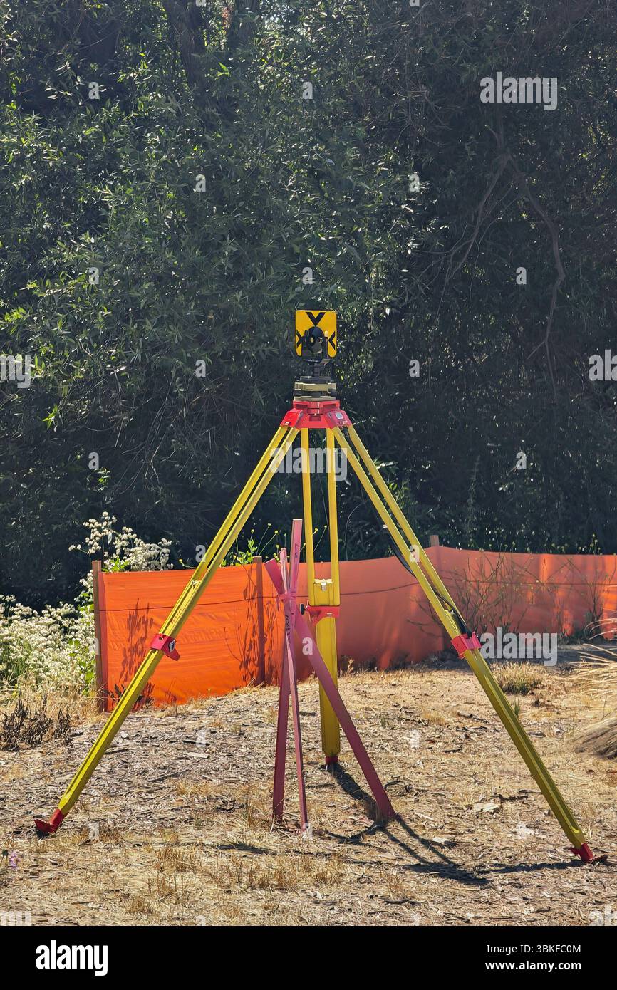 Surveyor equipment on tripod at construction site Stock Photo - Alamy