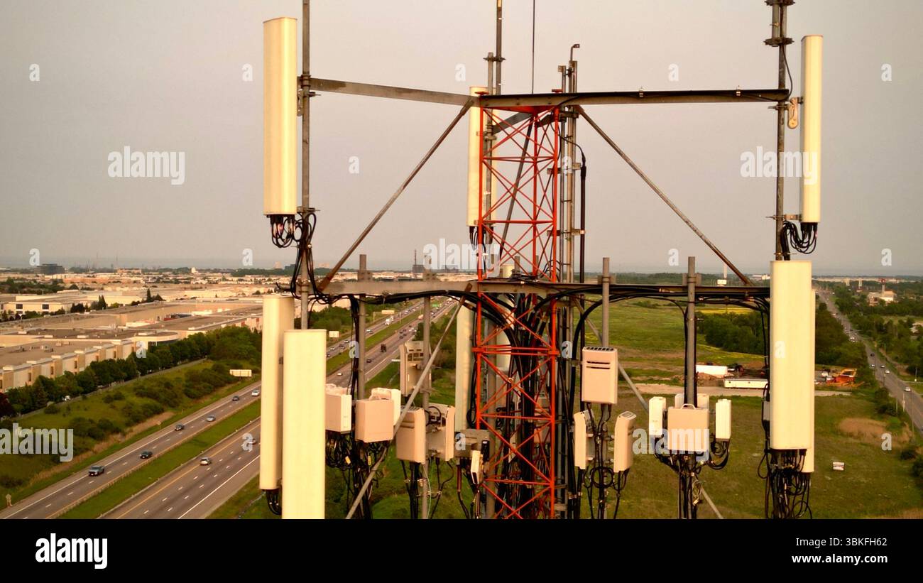 High above the ground, capturing the intricate details of a cell tower ...