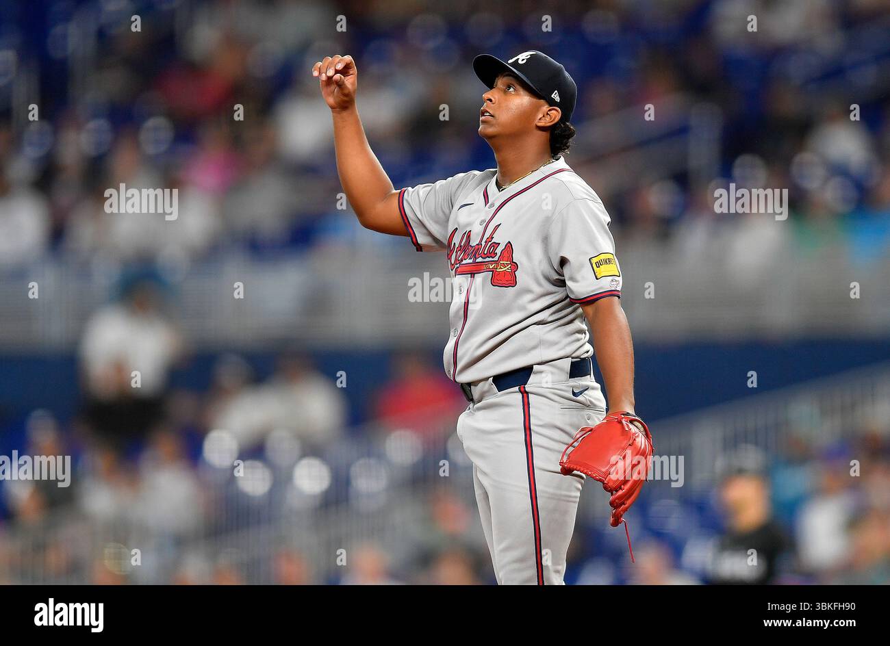 Atlanta Braves pitcher Didier Fuentes watches a fly ball hit by Miami ...