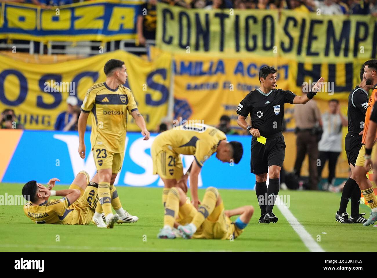 Referee Alireza Faghani shows a yellow card to Boca Juniors' Marcos ...